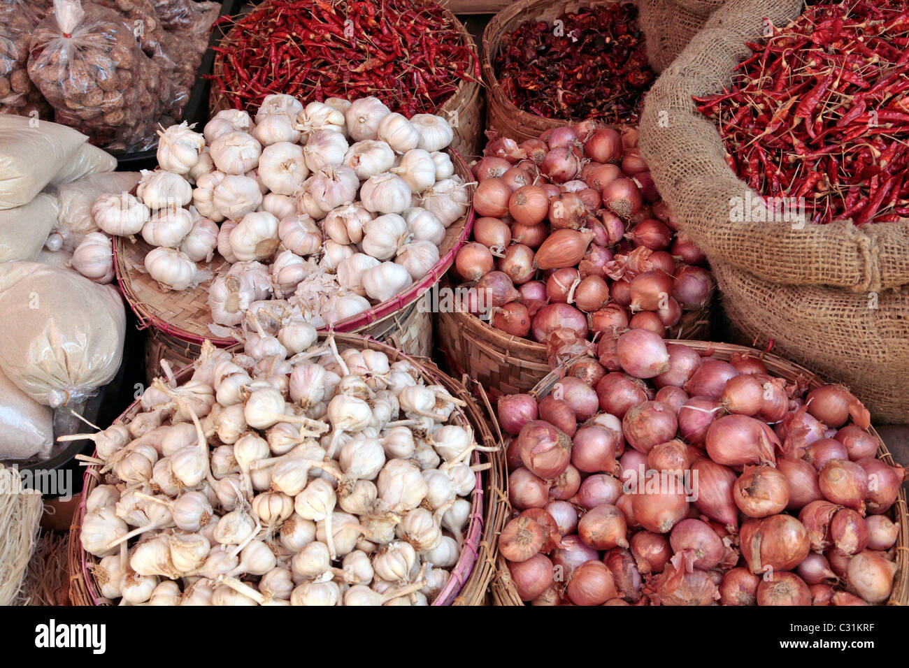 SPICE AND CONDIMENT STALL (ONIONS, GARLIC, CHILIES) AT THE MARKET IN ...