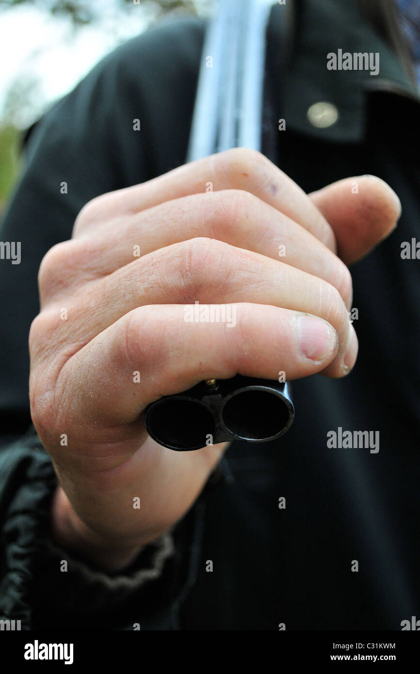 HUNTER CARRYING HIS FOLDING STOCK RIFLE OVER HIS SHOULDER Stock Photo ...