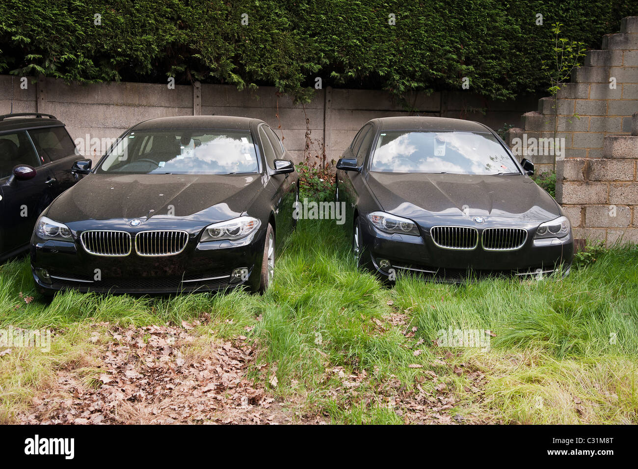 these-bmw-and-mini-motor-cars-are-stockpiled-by-a-main-dealer-at-a
