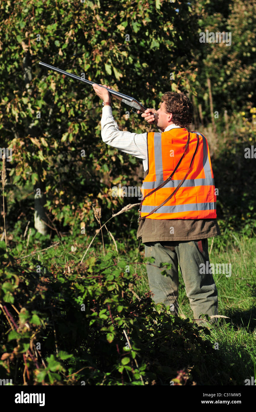 HUNTER TAKING AIM WITH HIS RIFLE AT A GAME FOWL, PAS-DE-CALAIS (62 ...