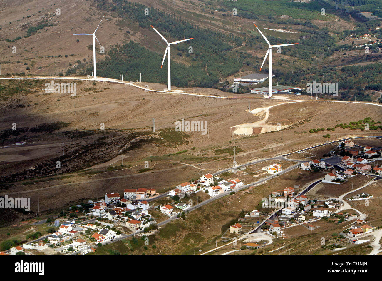 AERIAL VIEW OF WIND TURBINES NEAR A VILLAGE IN PORTUGAL Stock Photo - Alamy