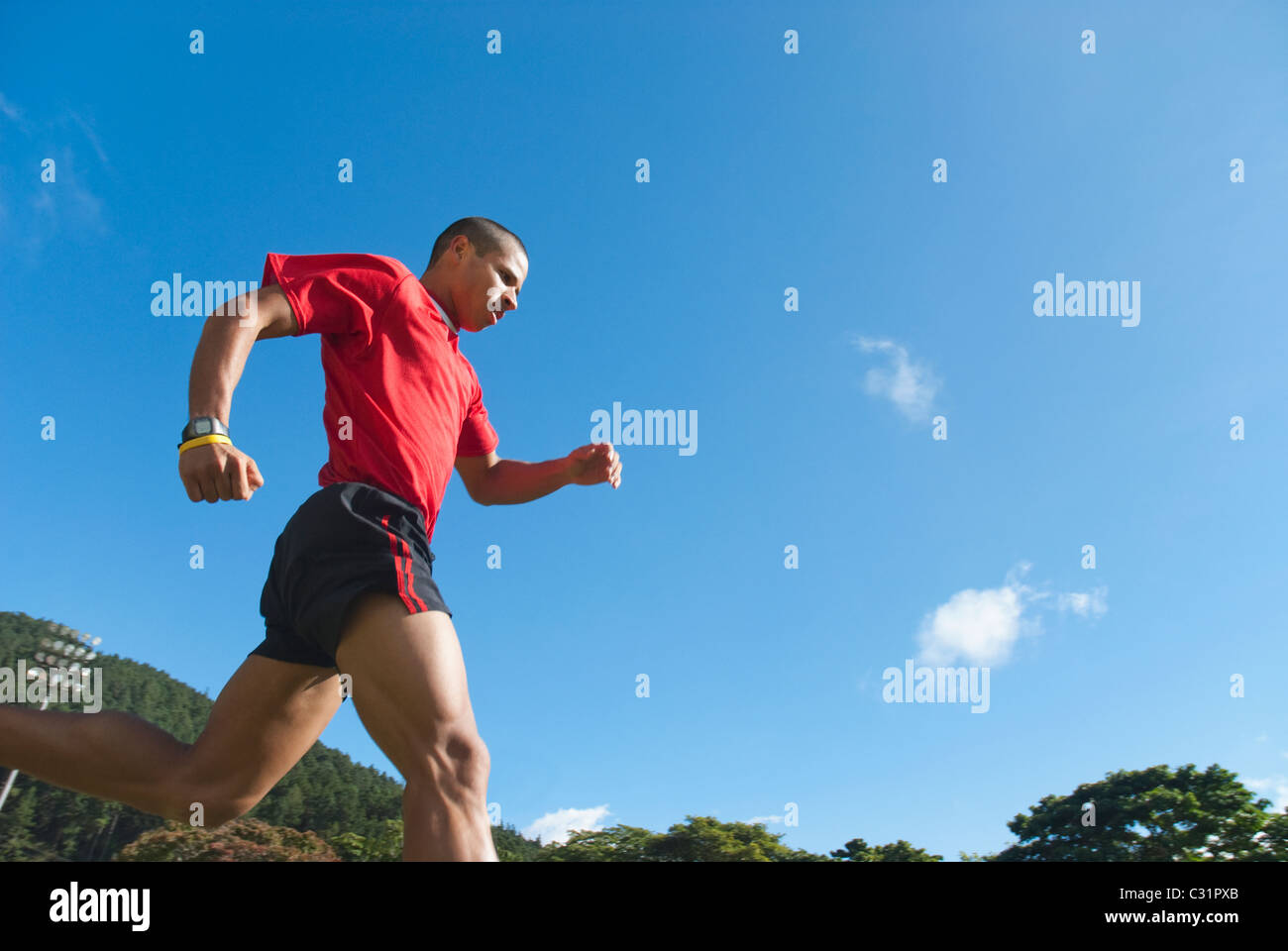Hispanic man running Stock Photo - Alamy