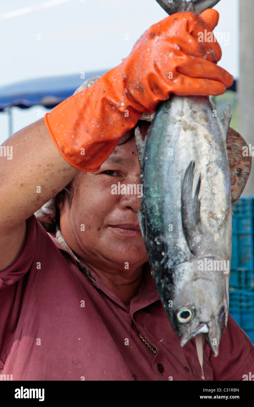 A WOMAN WITH A BONITO (THE SMALL, SKIPJACK TUNA) IN HER HAND, FISH ...