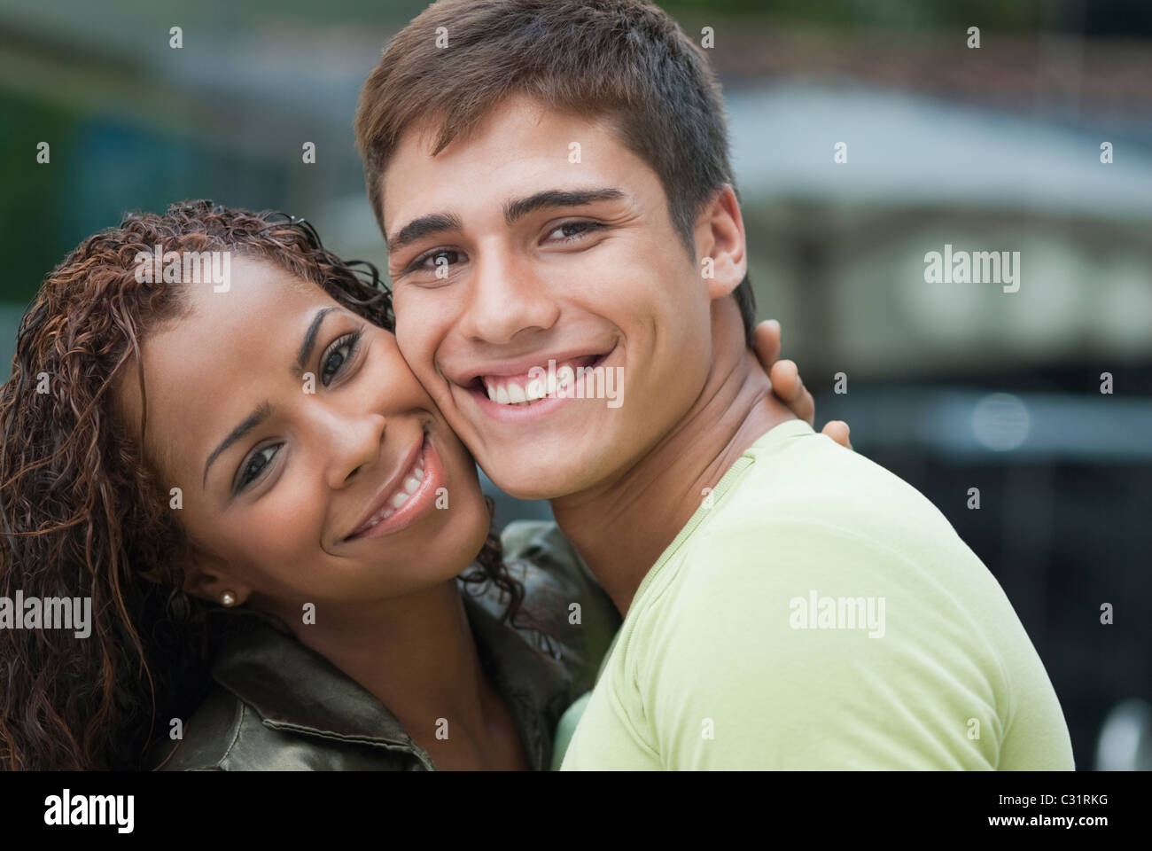 Smiling couple hugging Stock Photo - Alamy