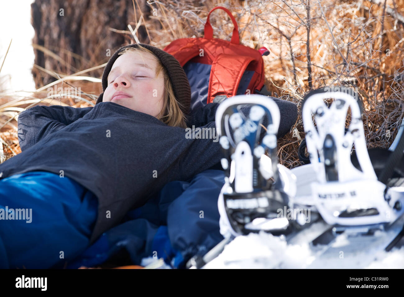 Boy sleeping under tree hi-res stock photography and images - Alamy