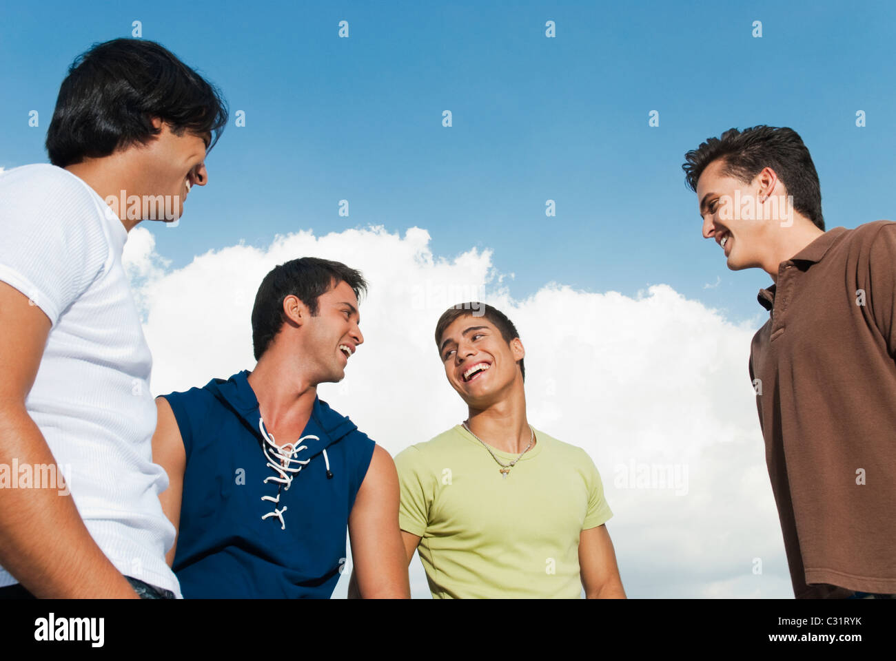 Friends laughing together outdoors Stock Photo - Alamy
