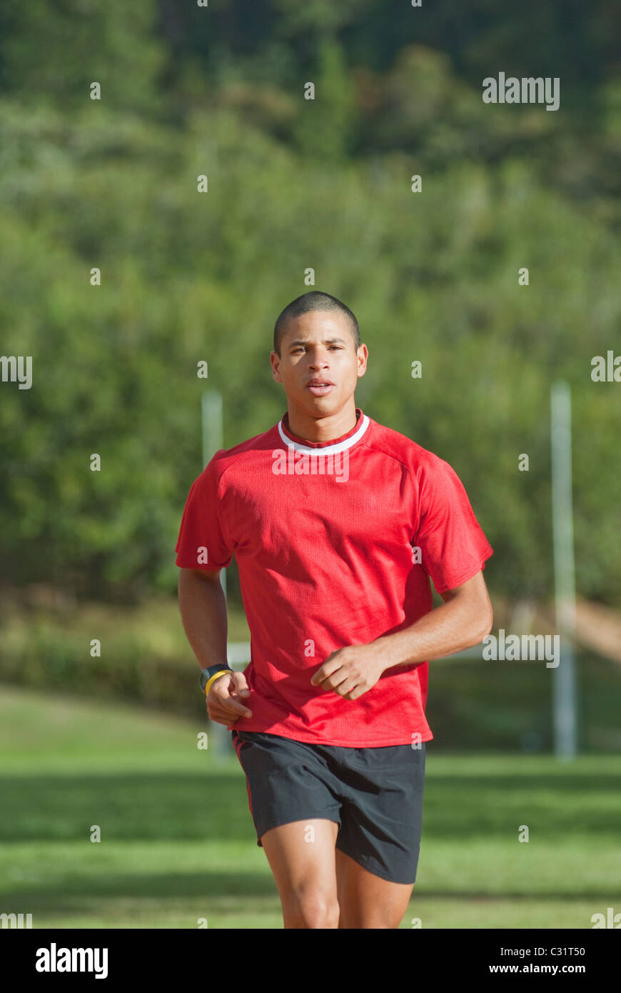 Hispanic man running Stock Photo - Alamy