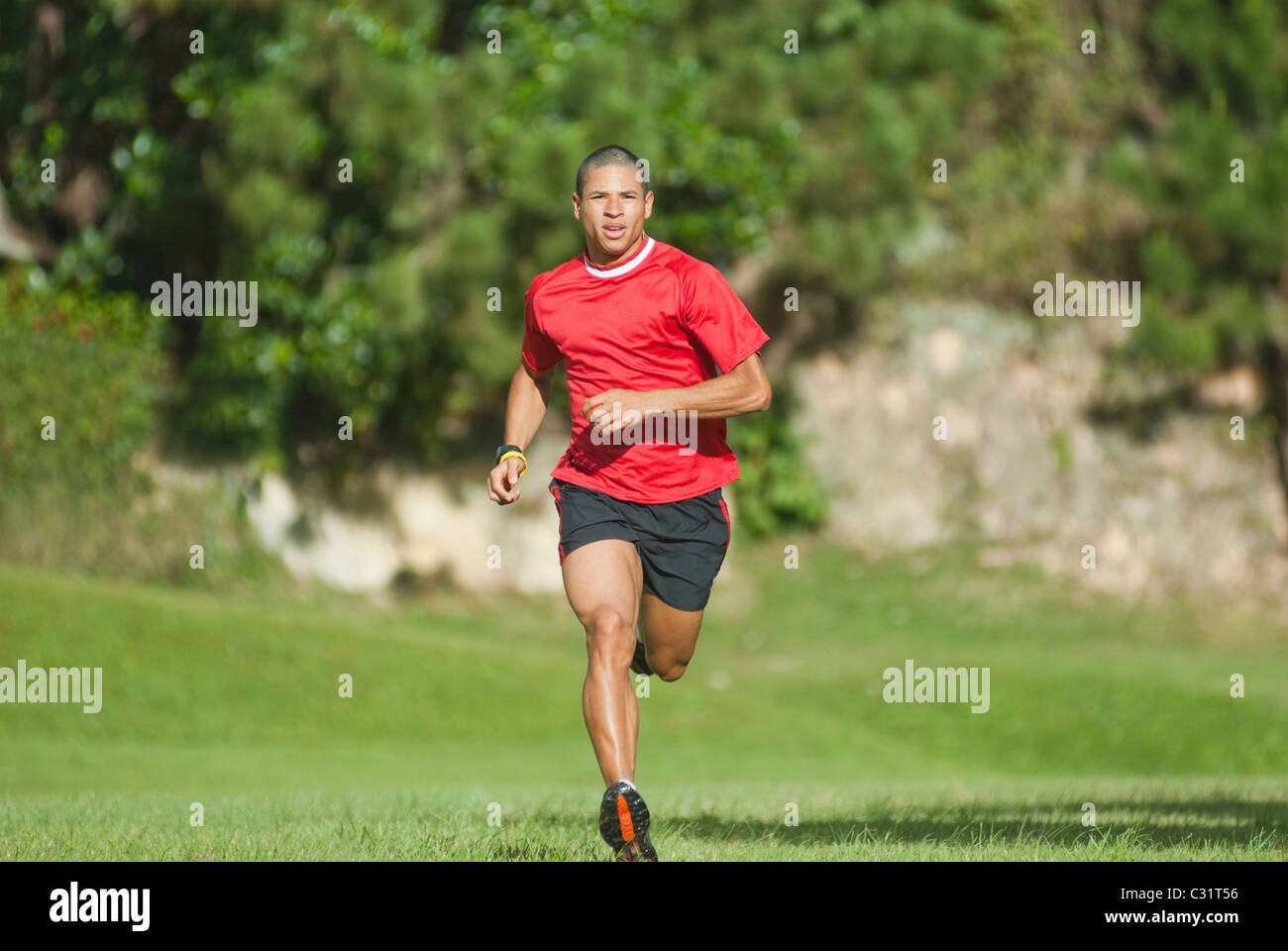 Hispanic man running Stock Photo - Alamy