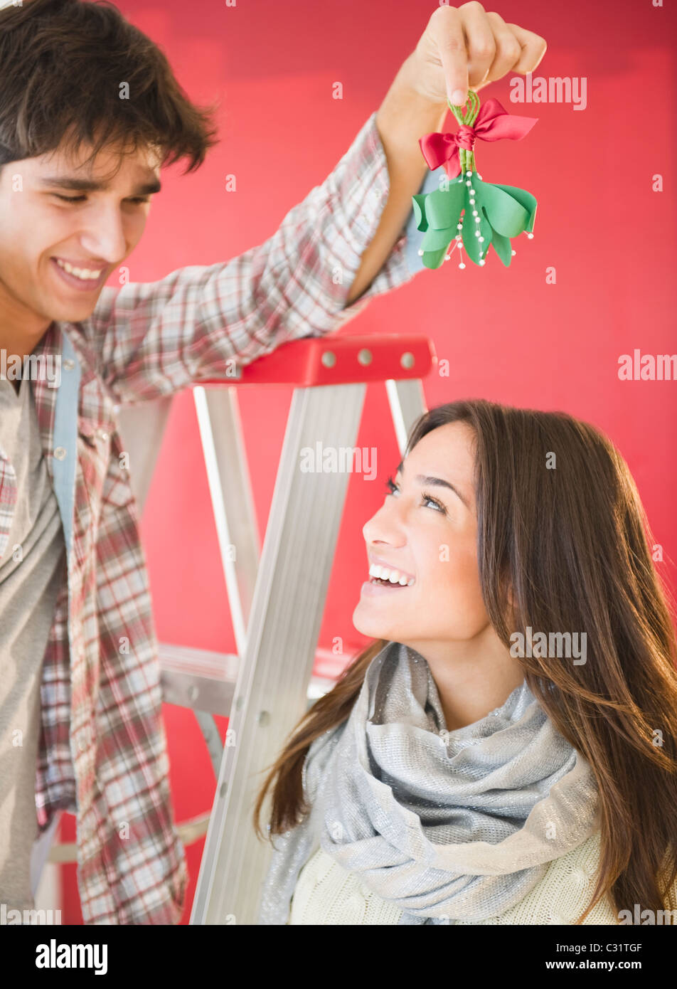 Man Holding Up Mistletoe High Resolution Stock Photography and Images ...