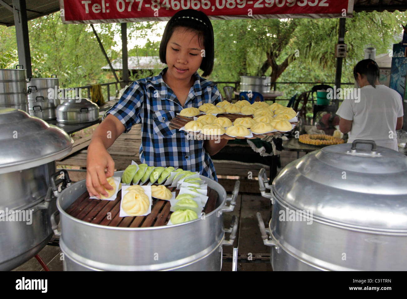 OUTDOOR COOKING IN A VILLAGE FAMOUS FOR ITS SPECIALTY OF STEAMED ...