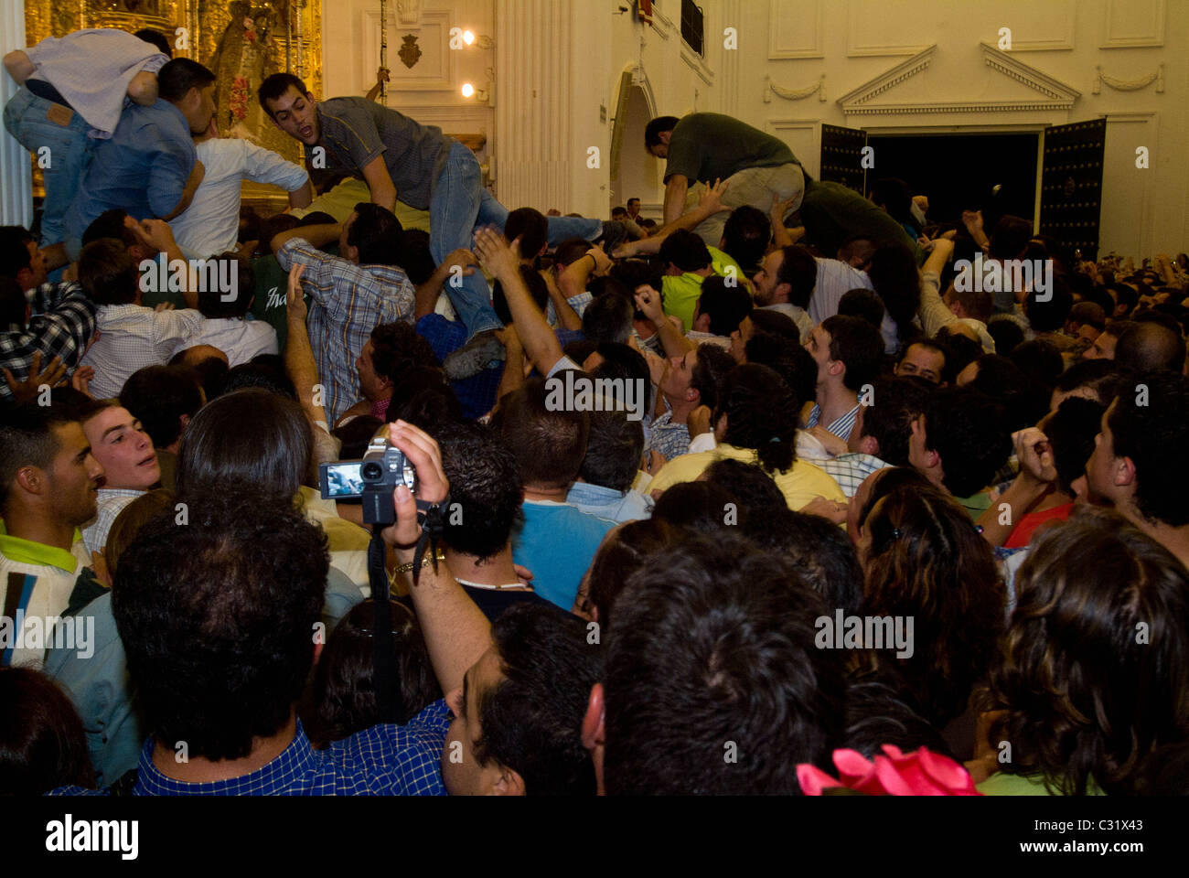 cheering and crying pelgrims during the celebrations of La Virgin del ...