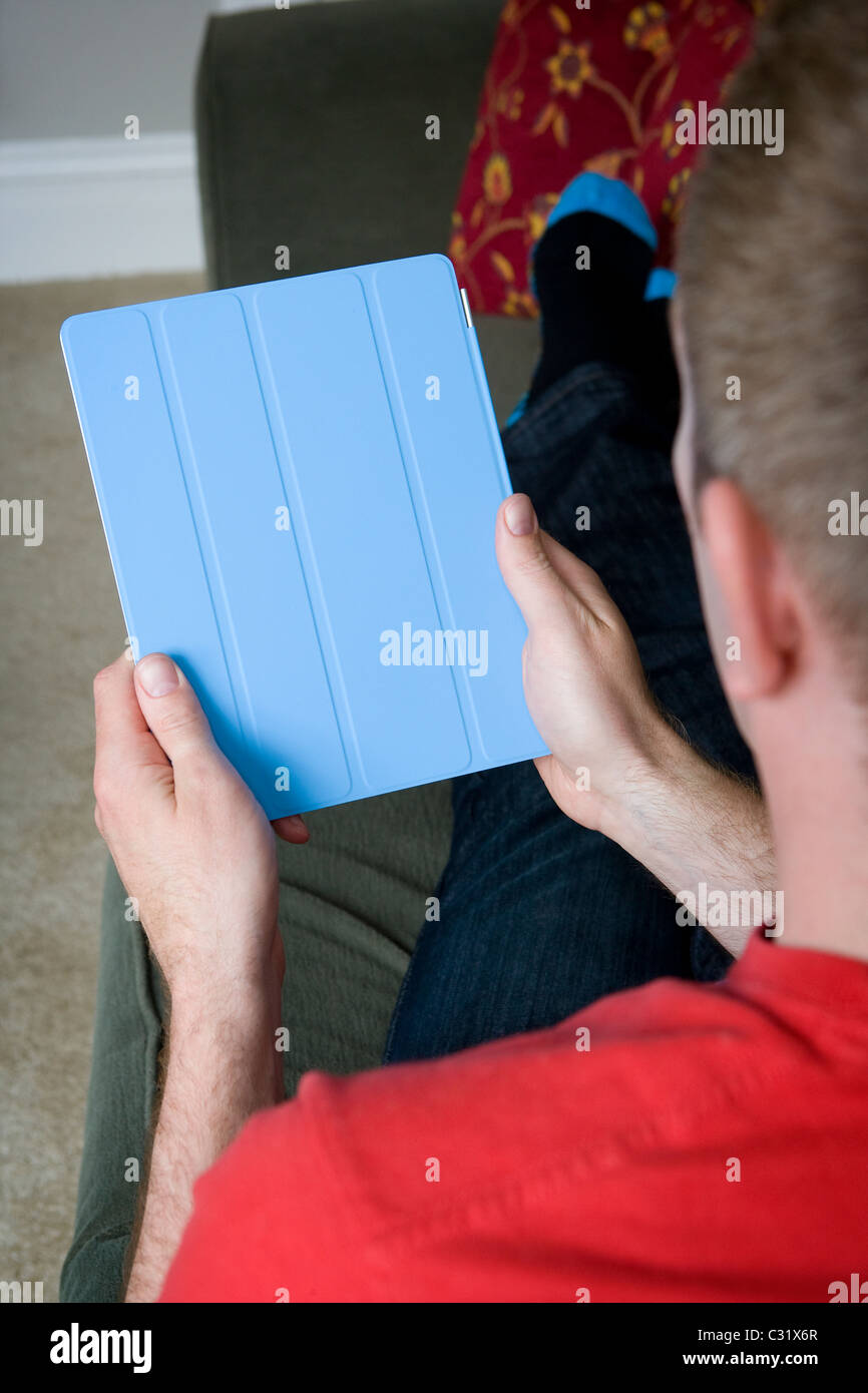 Two hands holding ipad hi-res stock photography and images - Alamy