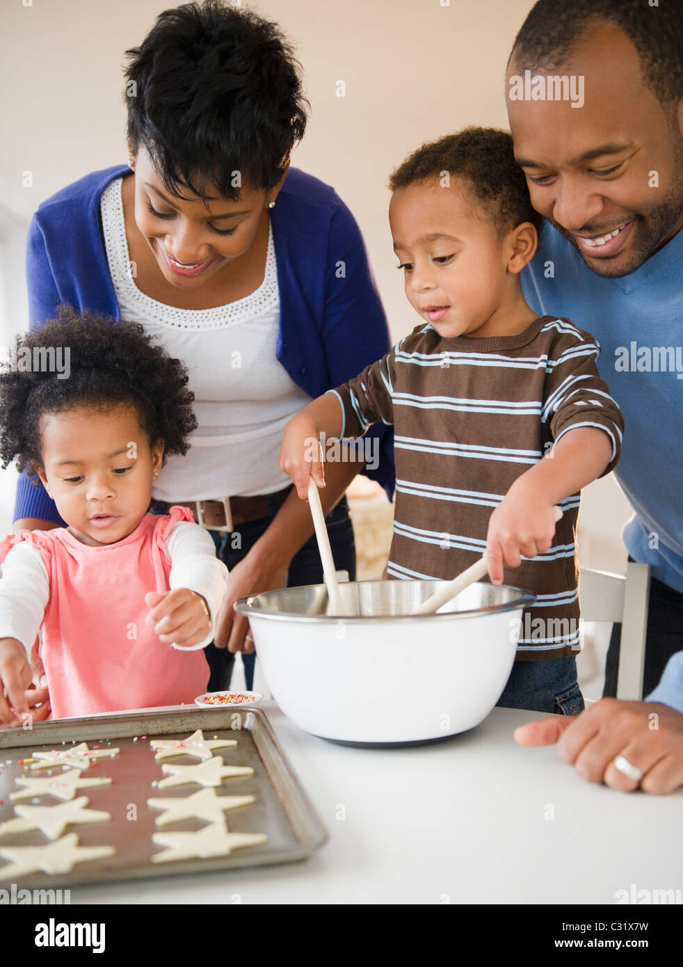 Black family baking cookies together Stock Photo - Alamy