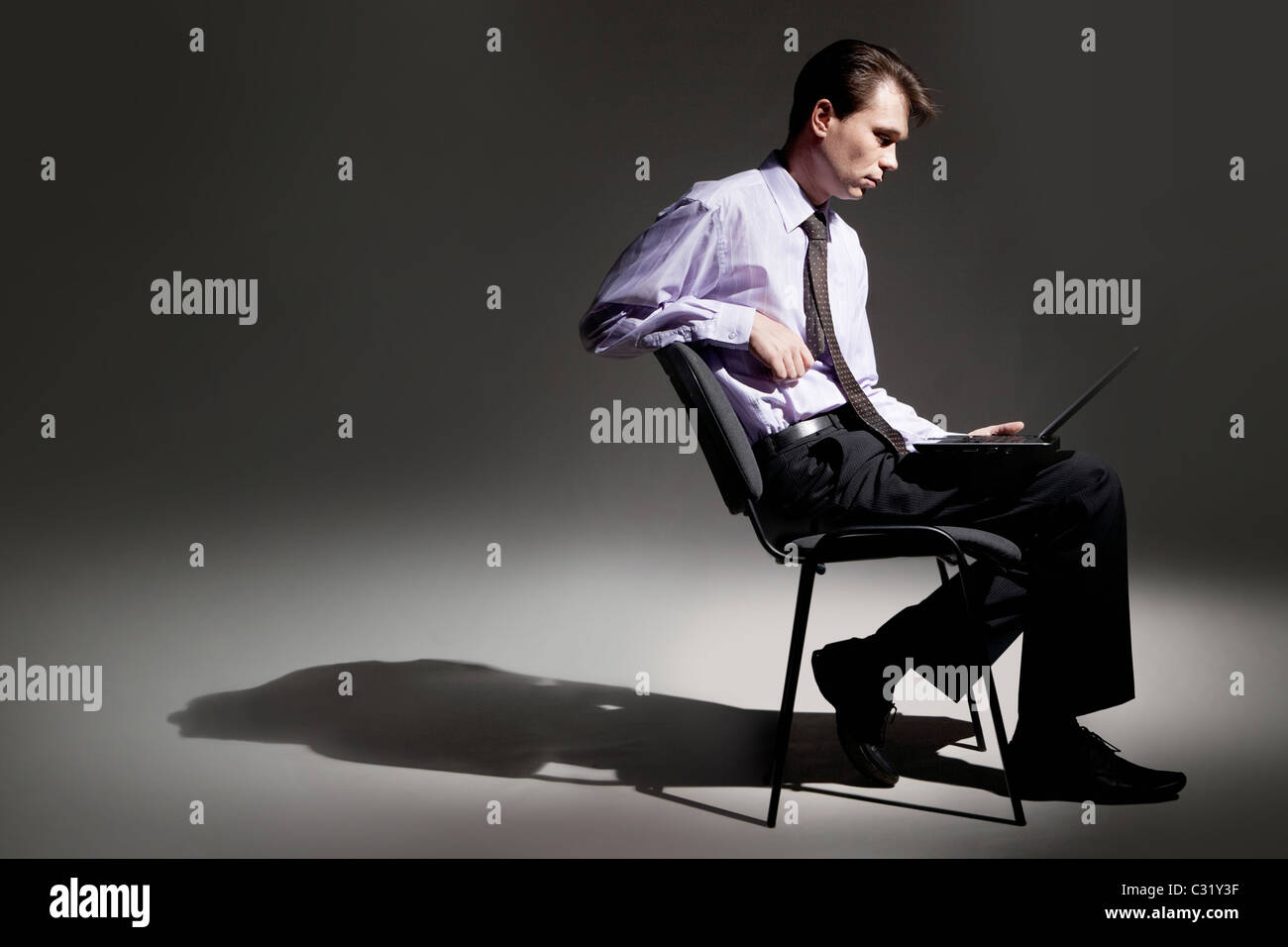 Black background working late hi-res stock photography and images - Alamy