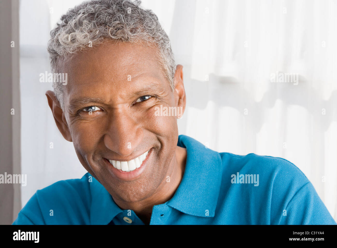 Smiling mixed race man Stock Photo - Alamy