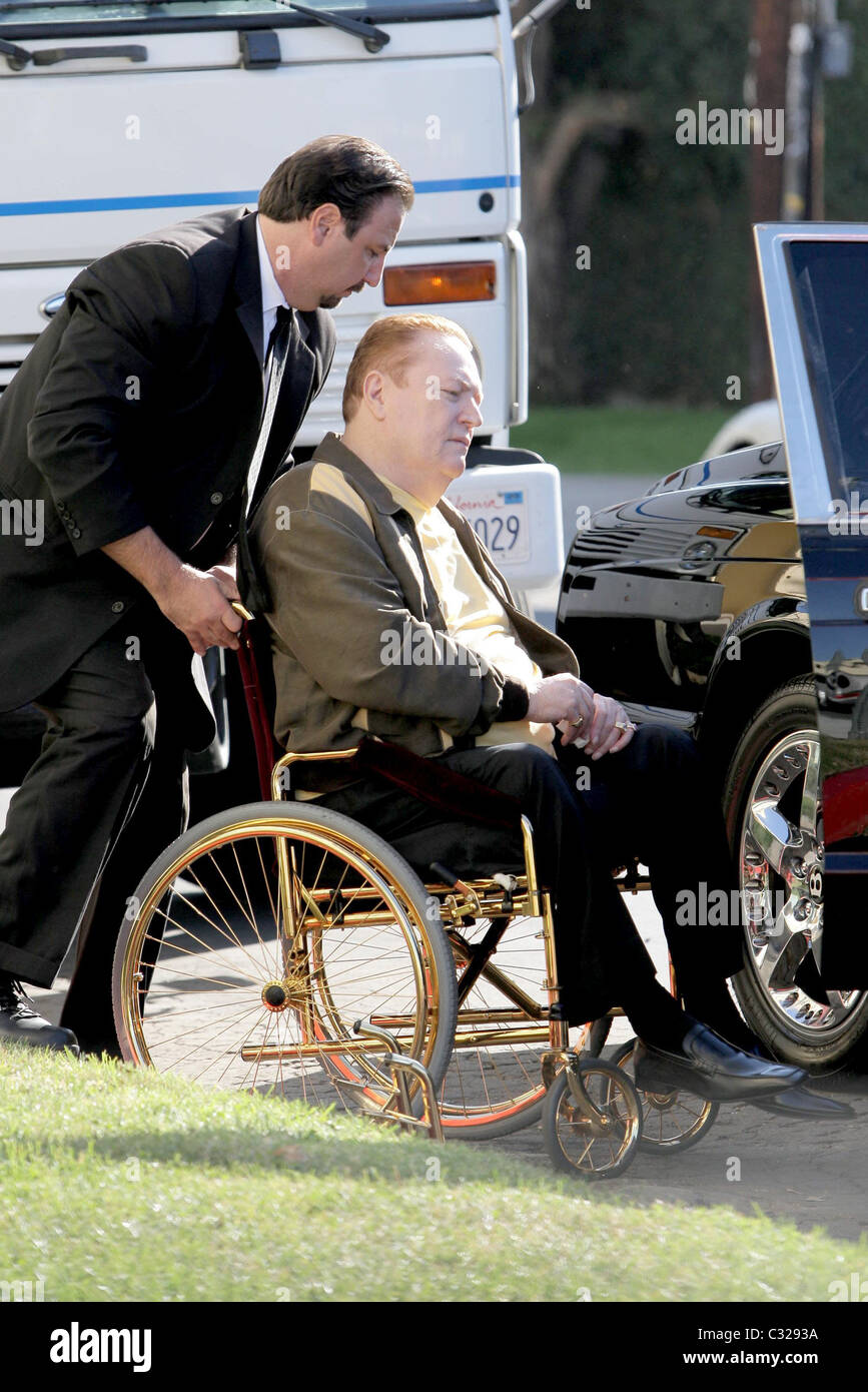 Larry Flynt gets picked up in his golden wheelchair by his driver while ...