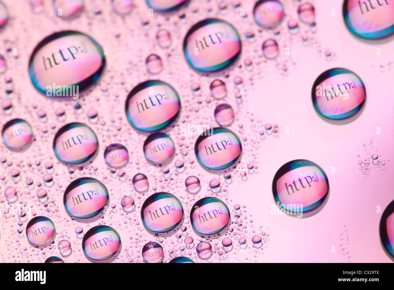 The words "http://" reflected in the drops of water. Close-up of water ...
