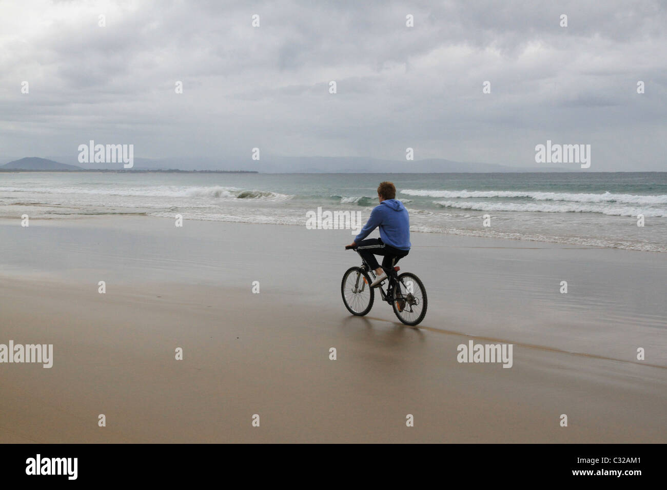Bicycle riding on a lonely beach on NSW South Coast, Australia Stock ...