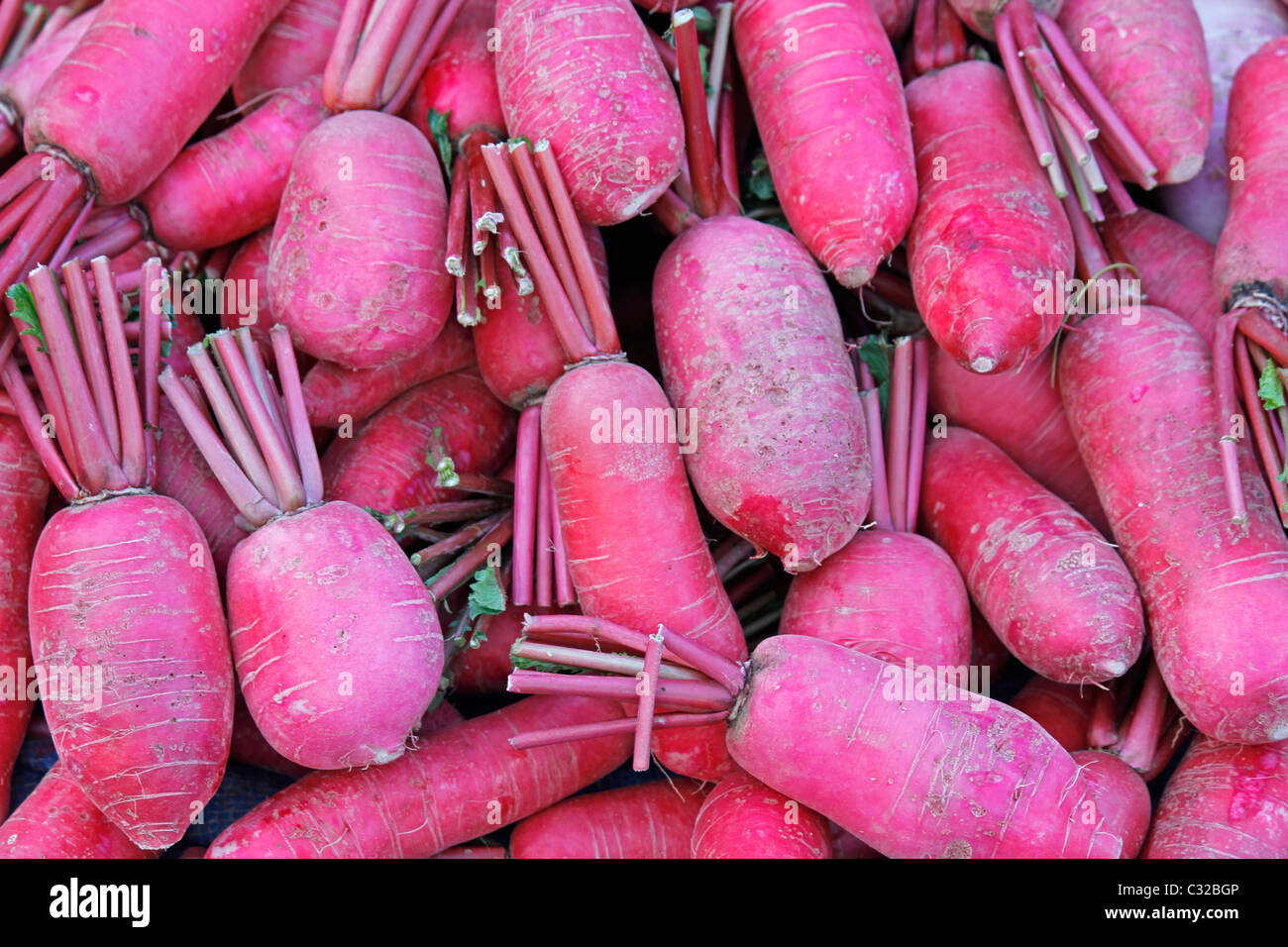 Full frame view of Red Radish in a market stall, Miao, Arunachal ...