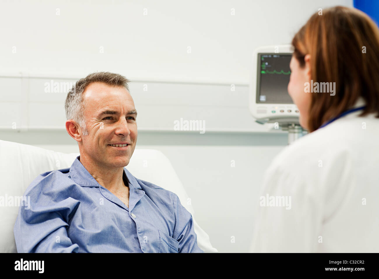 Male patient with doctor Stock Photo - Alamy