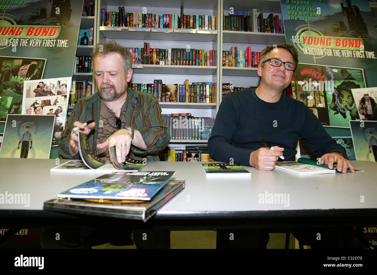 Illustrator Kev Walker and author Charlie Higson attend a signing ...