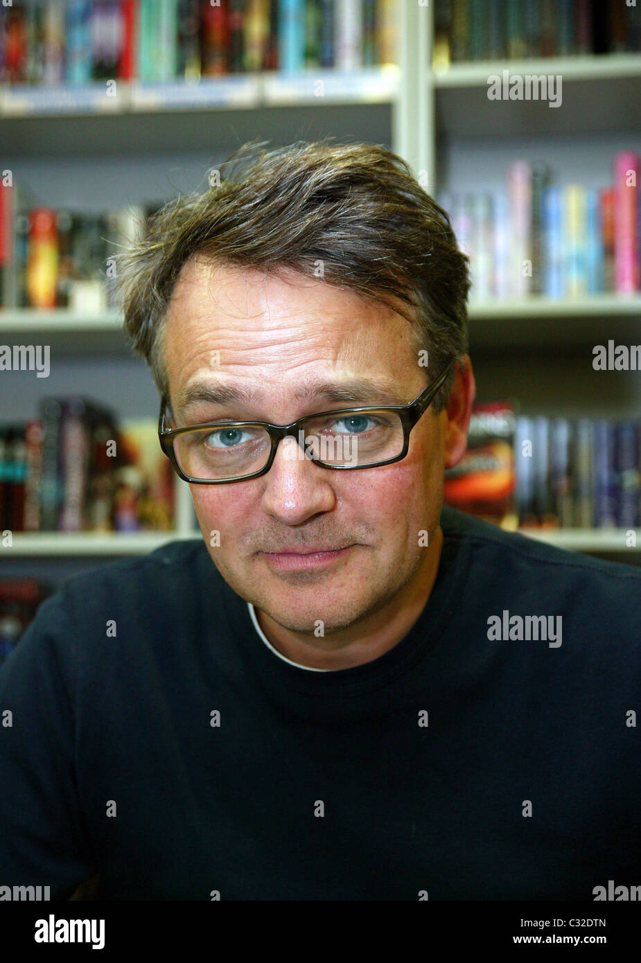 Author Charlie Higson attends a signing session to promote 'SilverFin ...