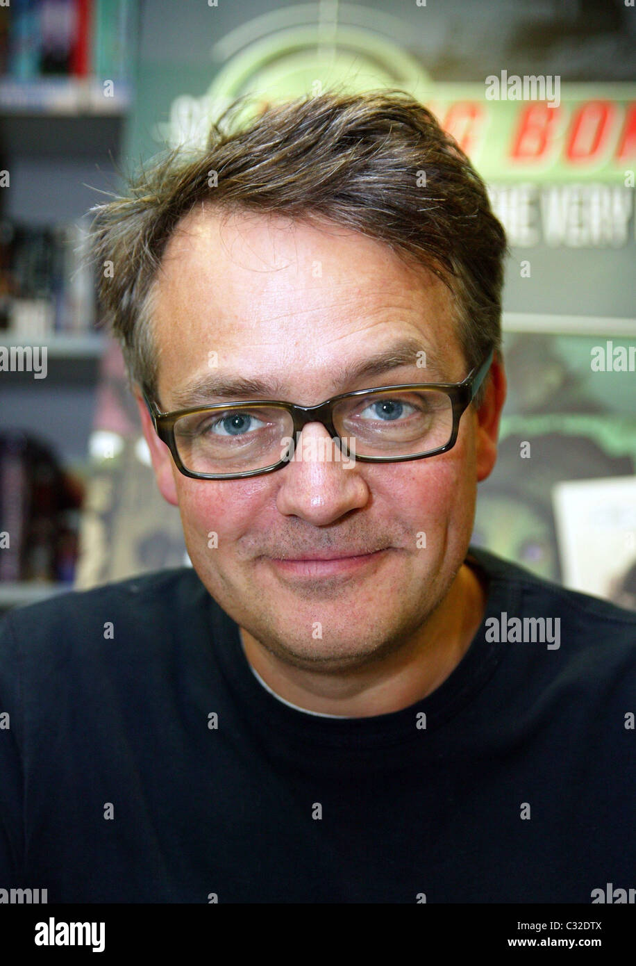 Author Charlie Higson attends a signing session to promote 'SilverFin ...