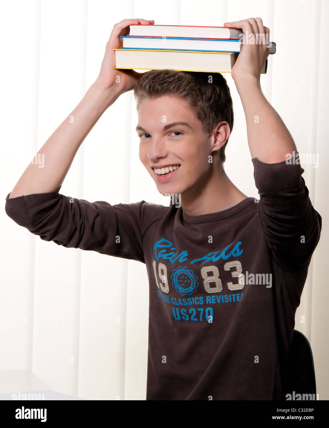 Young students learn with books Stock Photo - Alamy