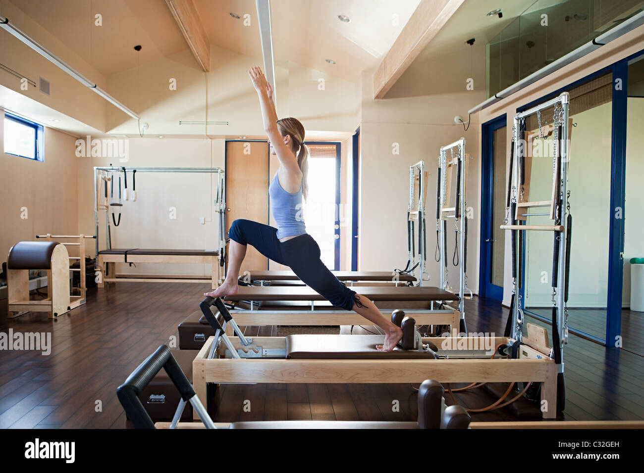 Young woman doing pilates Stock Photo - Alamy