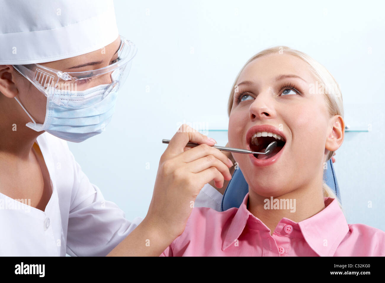Image of young woman during inspection of oral cavity with help of ...