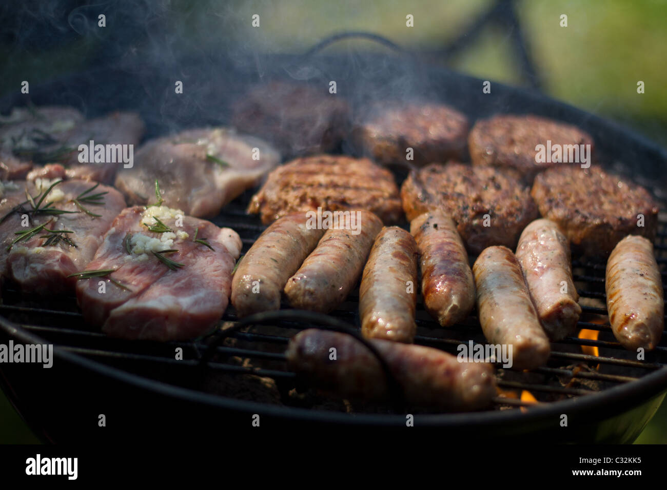 Food cooking on a BBQ Stock Photo - Alamy