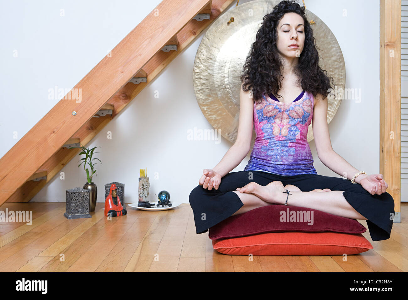 Women in lotus position during yoga Stock Photo - Alamy