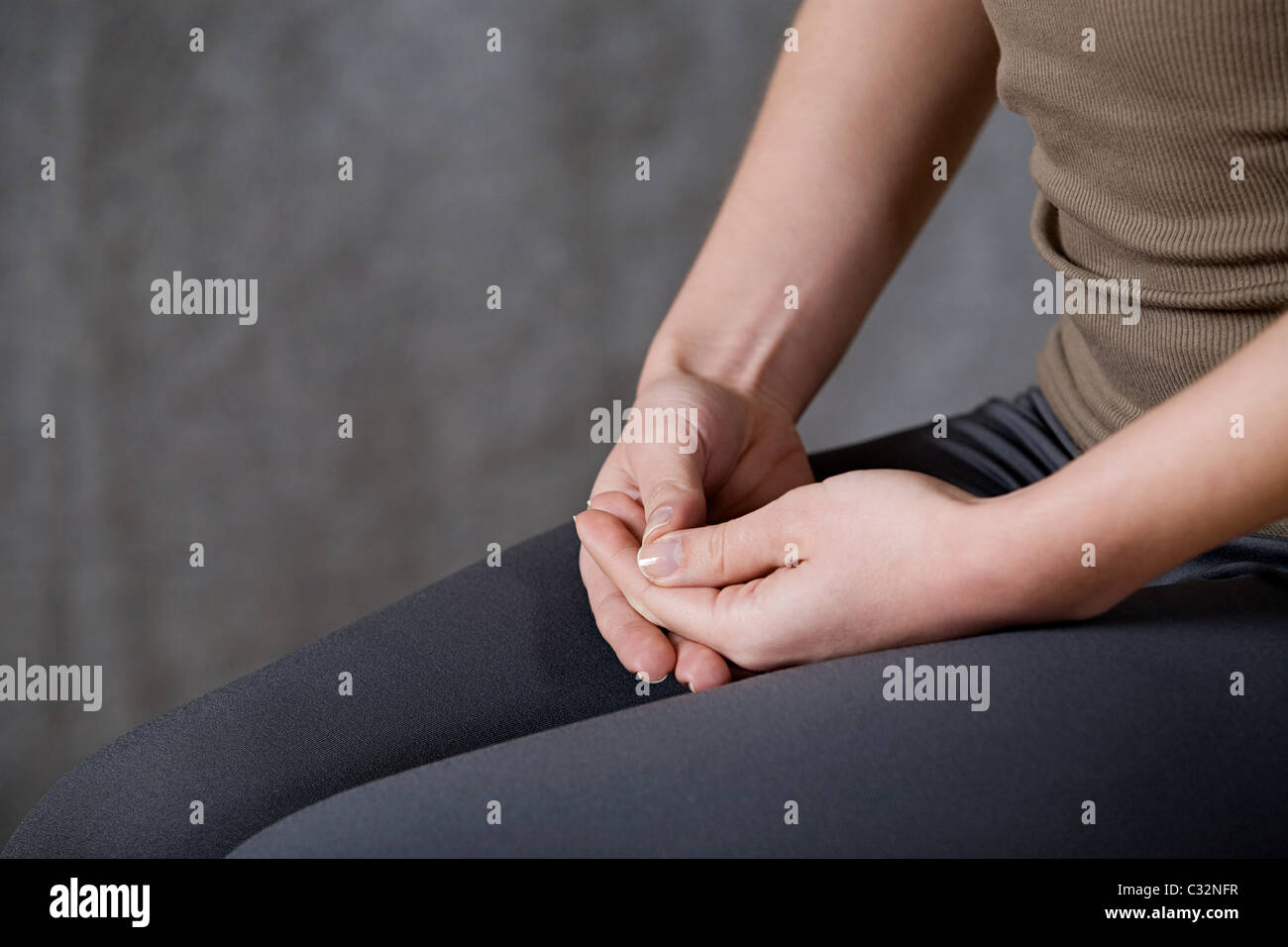 Woman with hands clasped, close up Stock Photo - Alamy