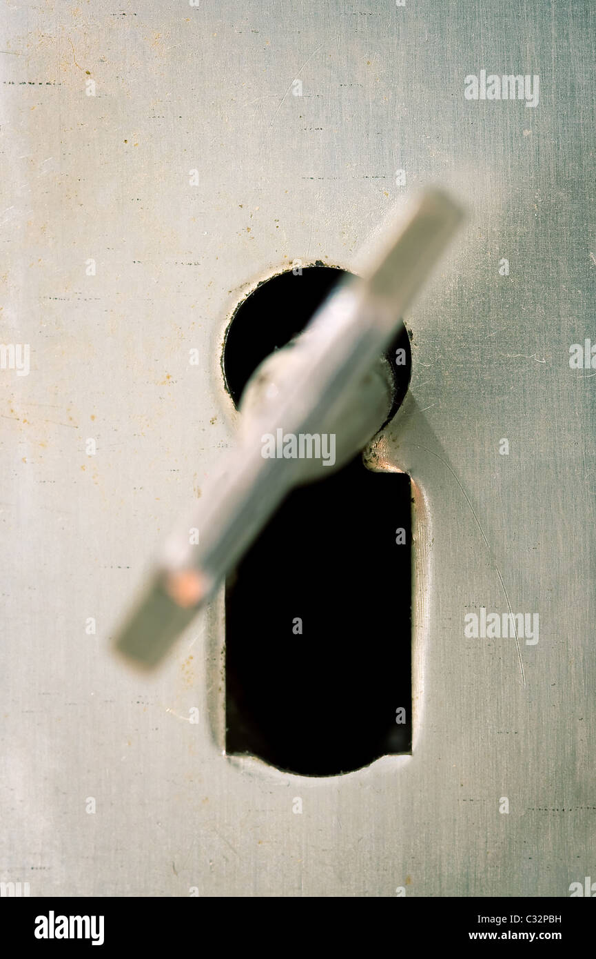 Key in a keyhole , close up photo, shallow DOF and text-space Stock ...