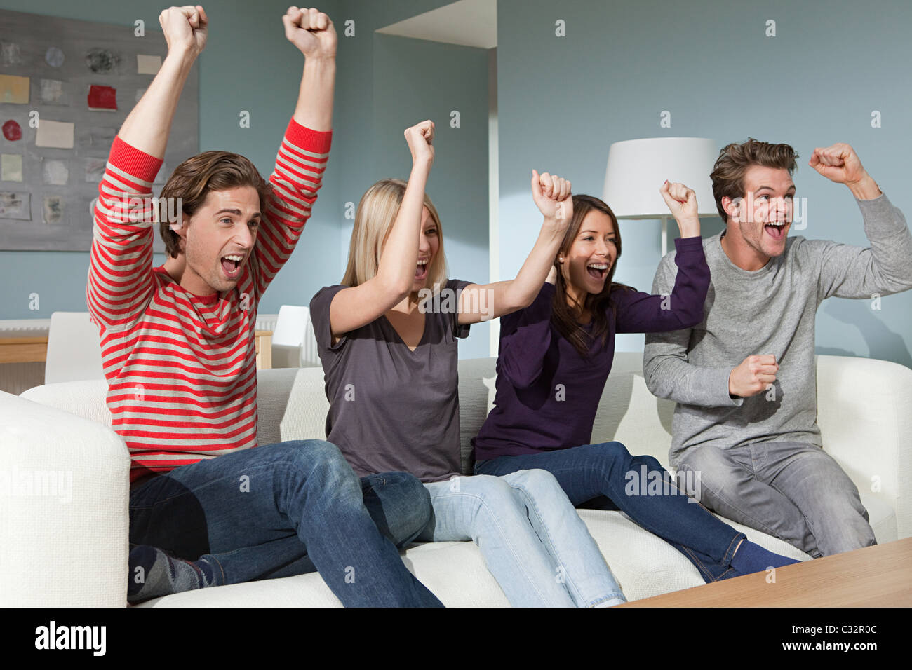 Small group friends watching tv hi-res stock photography and images - Alamy