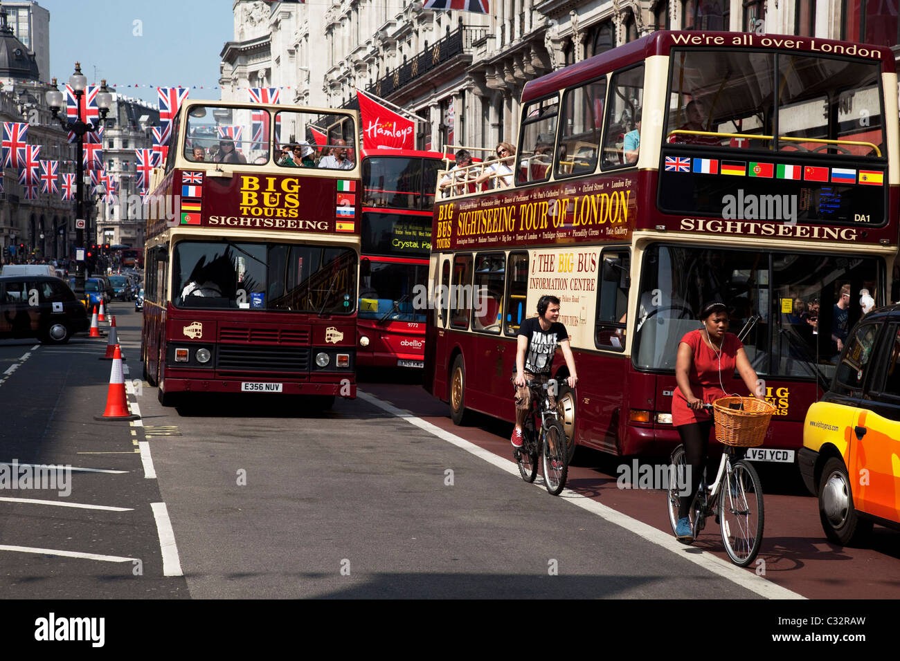 Sightseeing tour buses on Regent Street, London. A display of 200 giant ...
