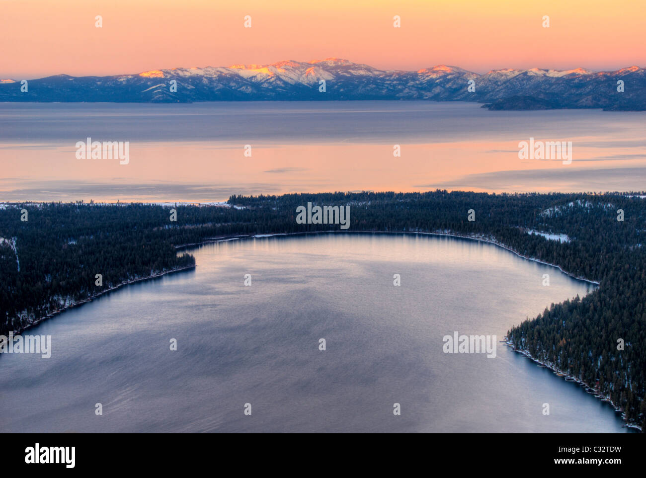 A view of Fallen Leaf Lake and Lake Tahoe in the winter at sunset ...