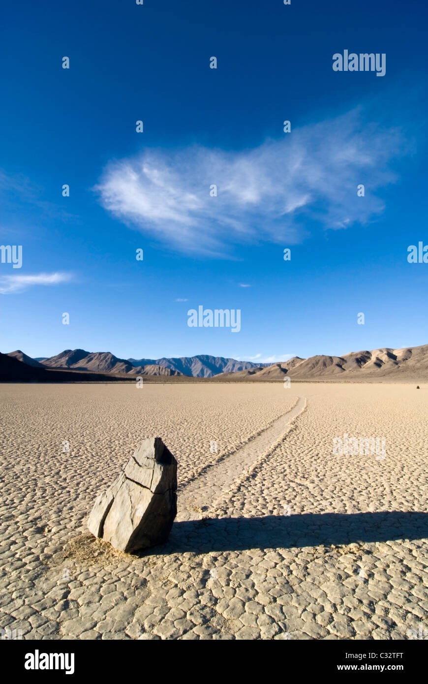 A rock leaves a trail of its movement across the sand on the famous ...