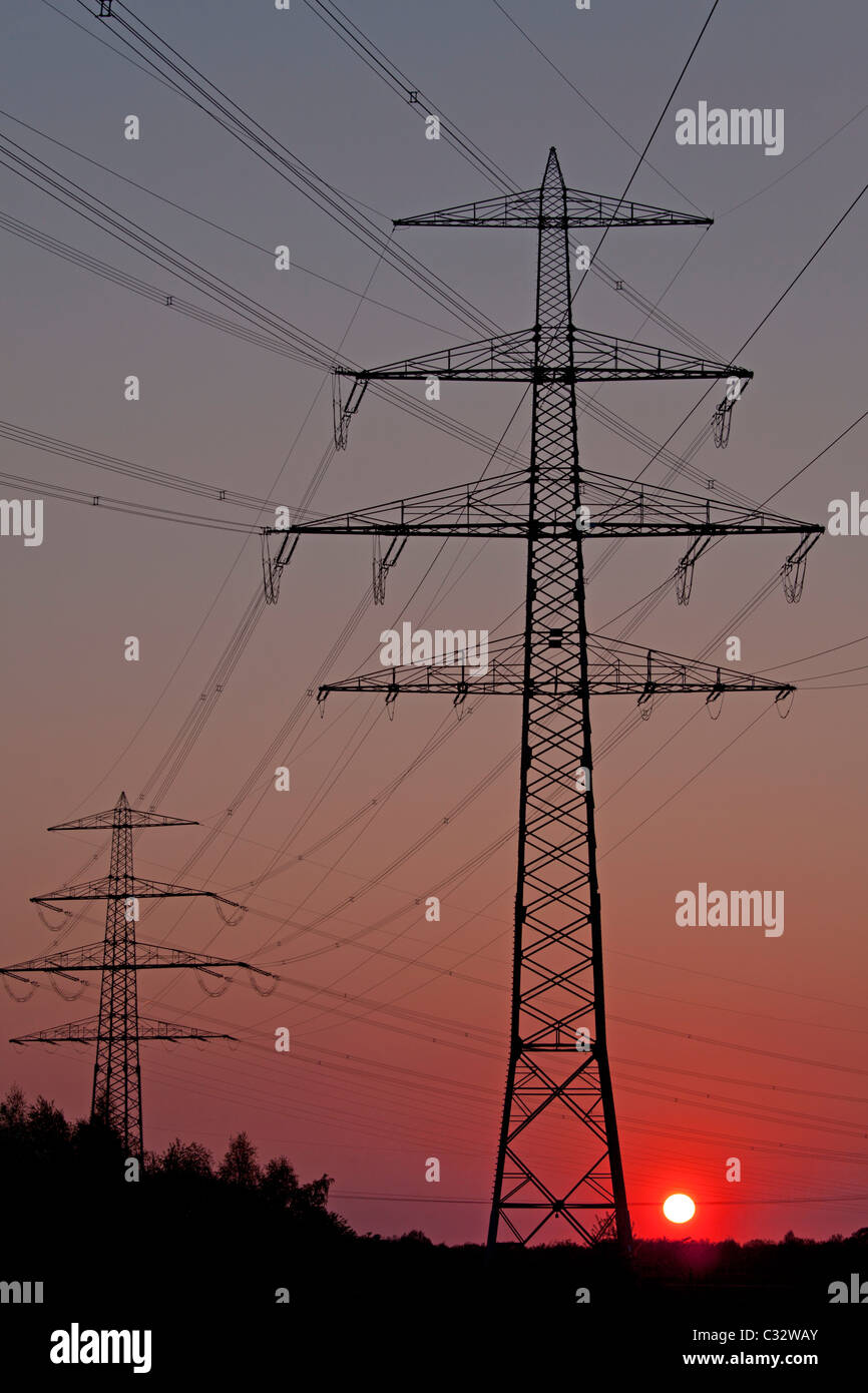 sunset behind pylons Stock Photo - Alamy