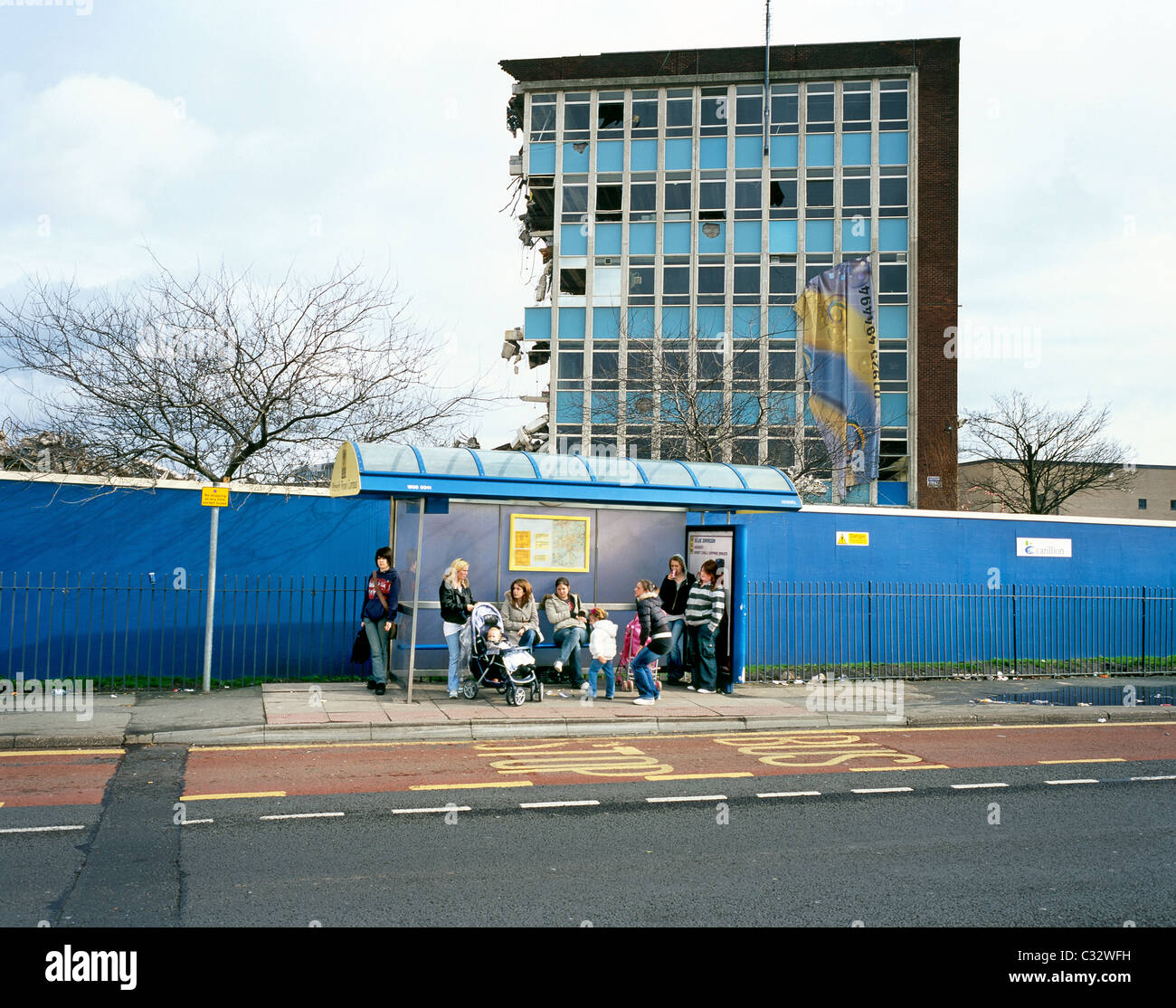 Bustop with demolished high-rise Stock Photo - Alamy
