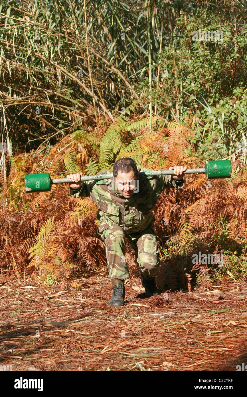 Military physical training, making jump´s with weight on the shoulders ...