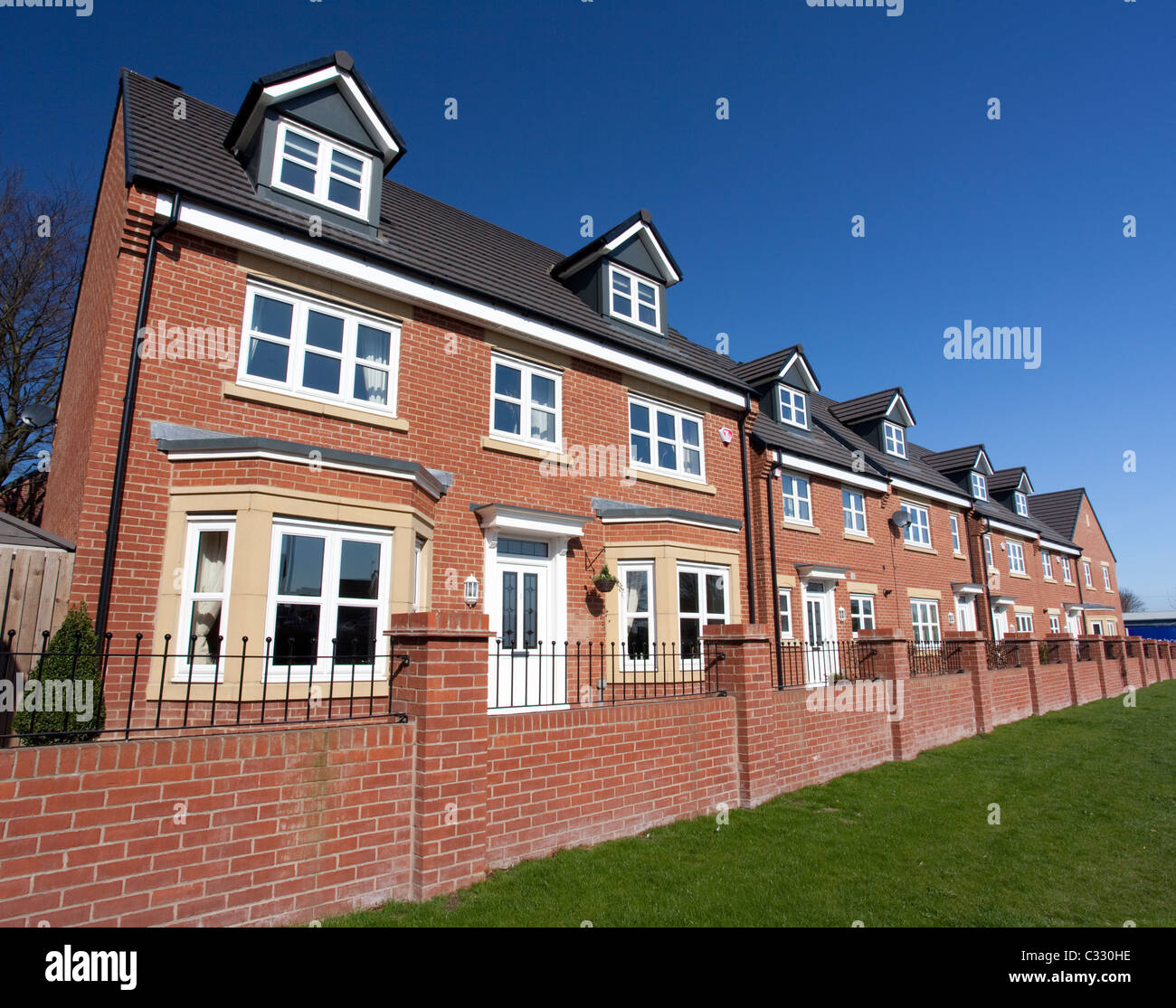 Row of new houses Stock Photo - Alamy