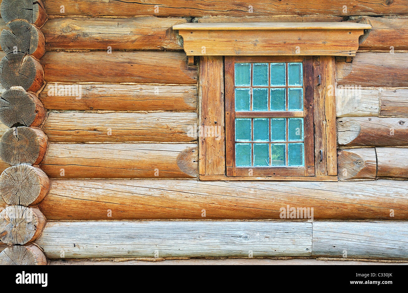 Log wall and window Stock Photo - Alamy