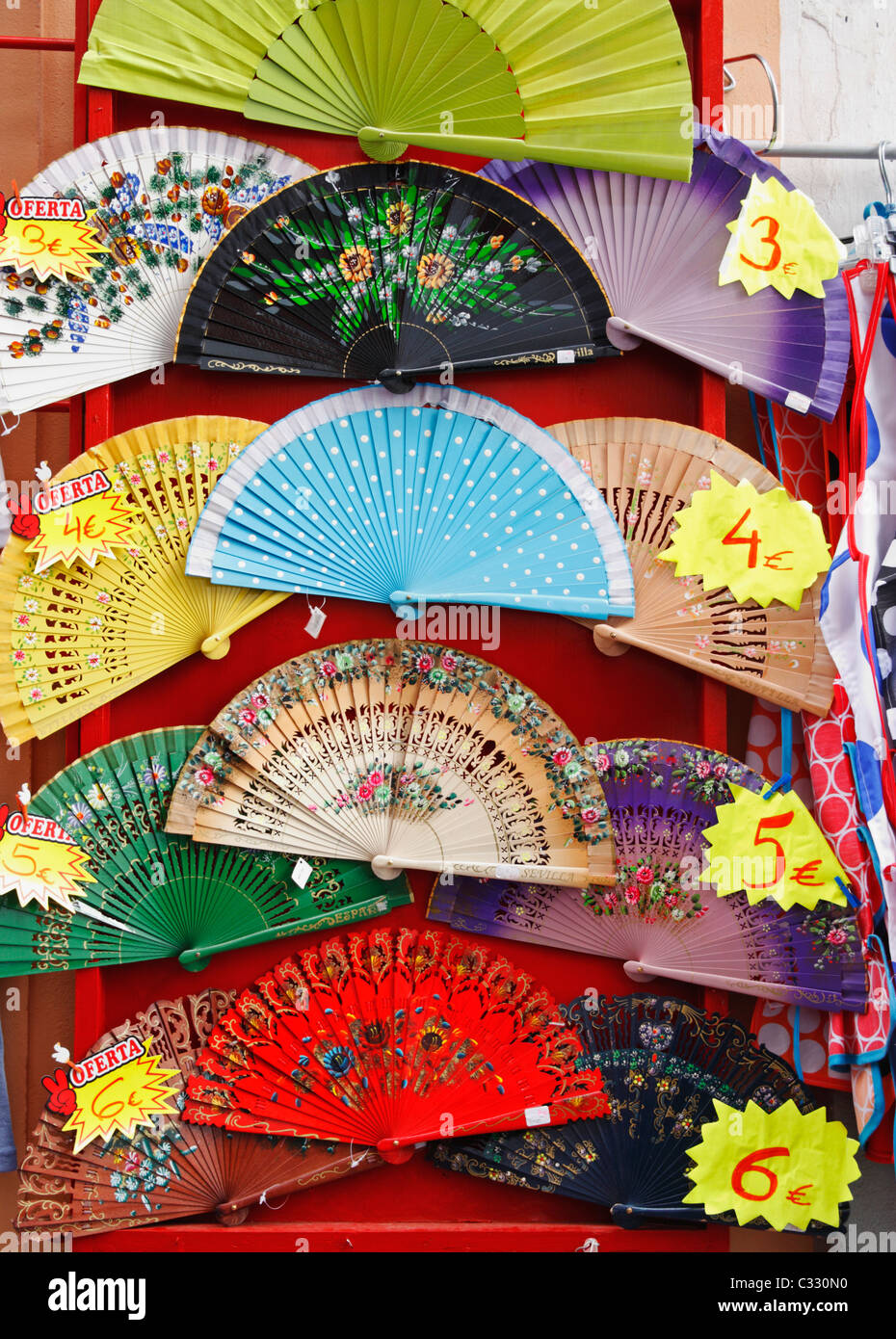 Fans outside shop in Seville, Andalusia, Spain Stock Photo - Alamy