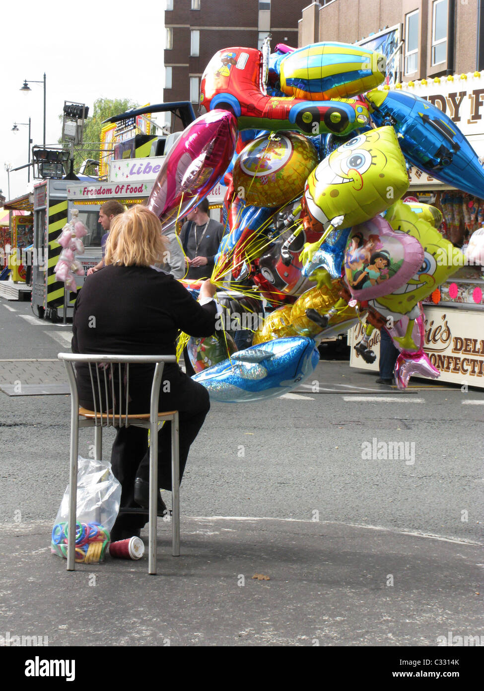 Balloon seller in high street hi-res stock photography and images - Alamy
