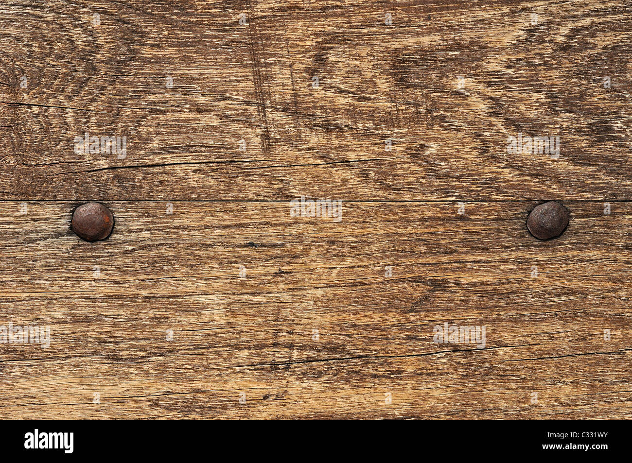 Wooden board with rivets Stock Photo - Alamy