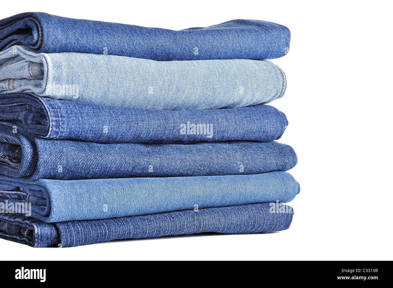Stack of jeans isolated Stock Photo - Alamy