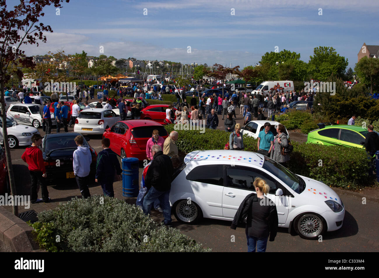 crowds in a car park at a modified car show in the uk Stock Photo - Alamy
