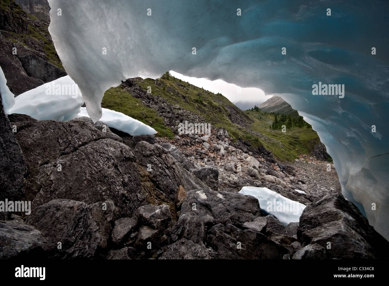 Fantastic blue wavy ice shape (glacier) against a valley in Sayan ...