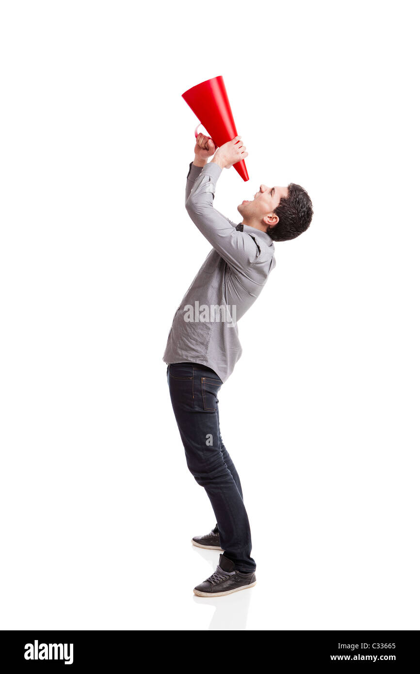 Young man shouting into a megaphone over a white background Stock Photo ...